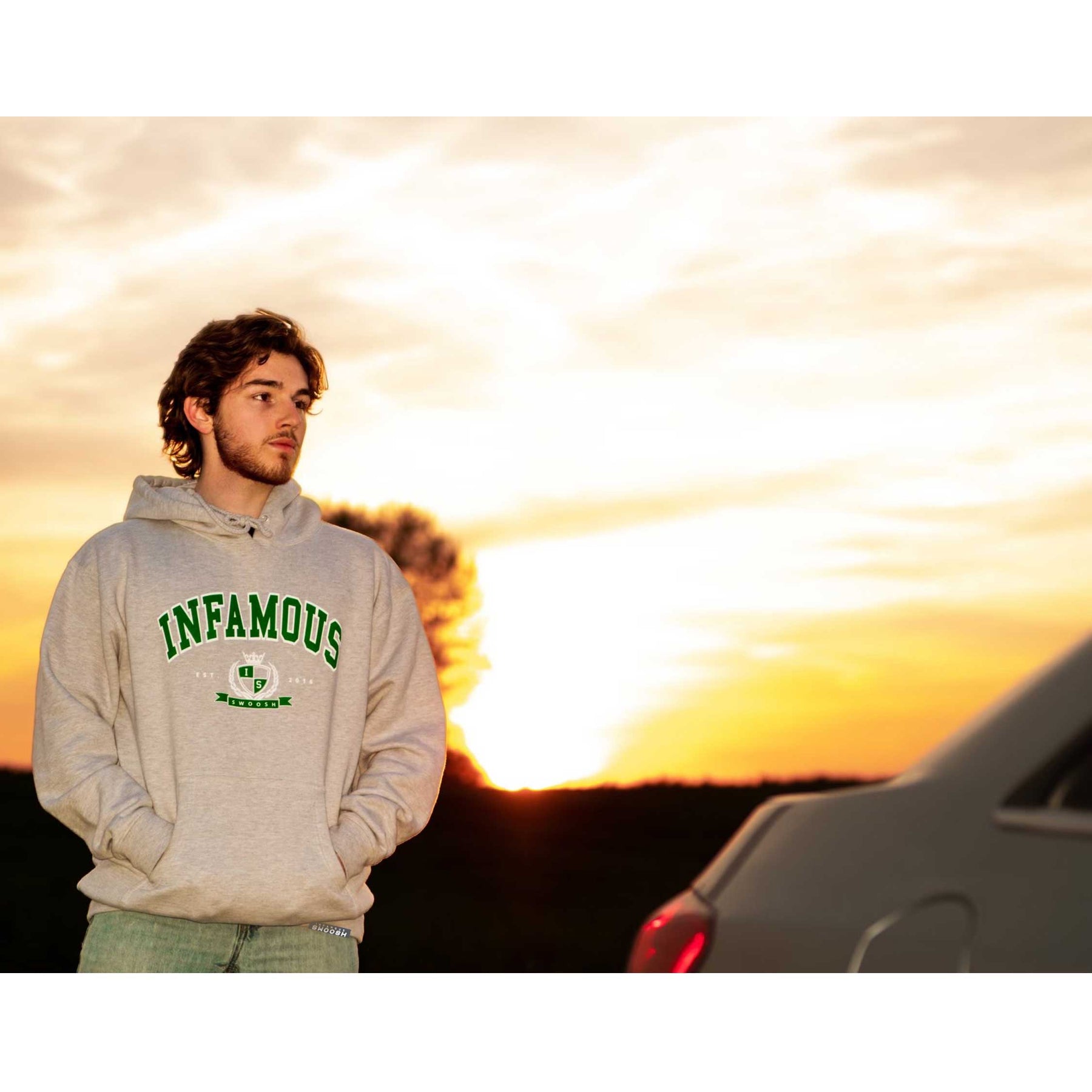 INFAMOUS Varsity Hoodie | Official Infamous Swoosh Merch – Creator Ink