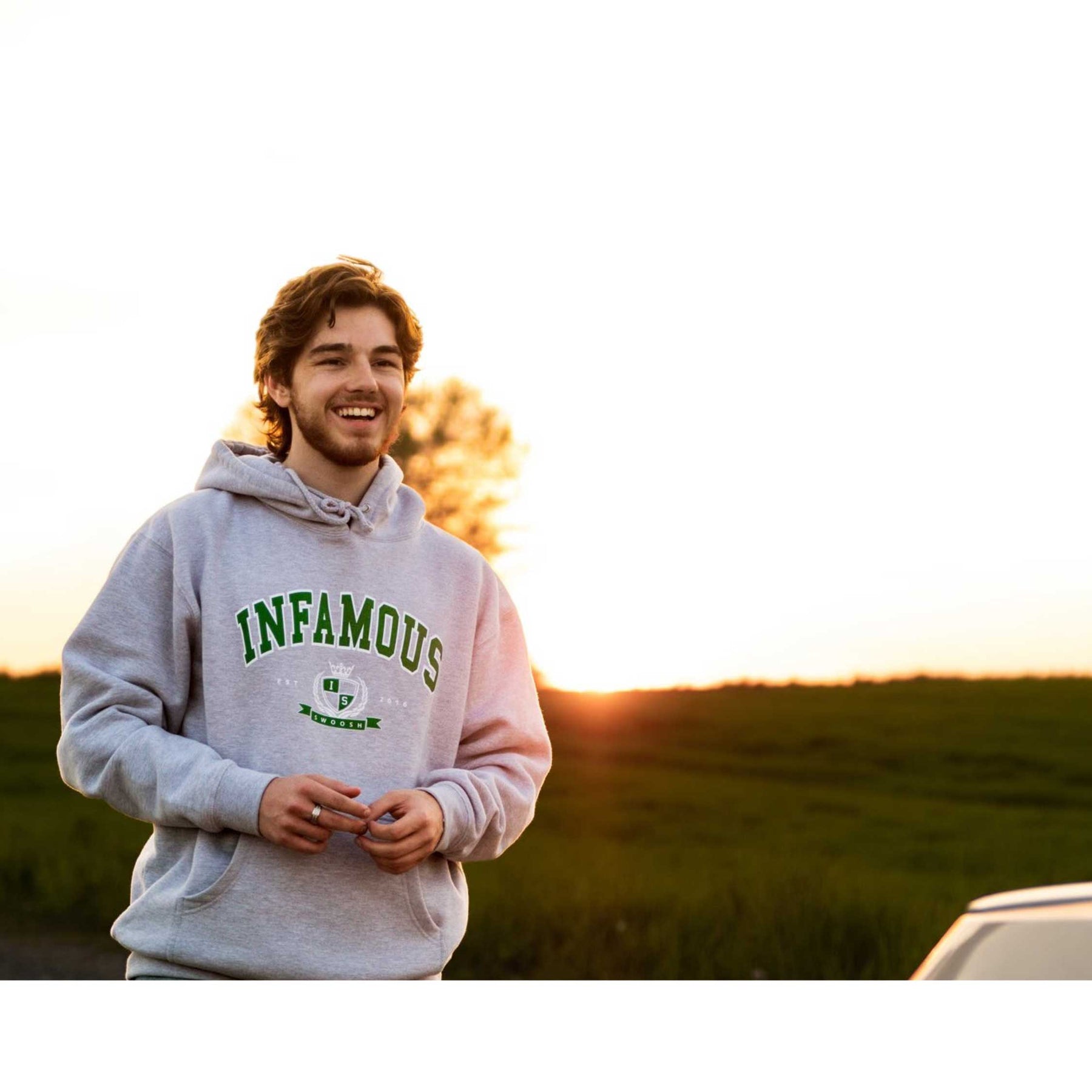 INFAMOUS Varsity Hoodie | Official Infamous Swoosh Merch – Creator Ink